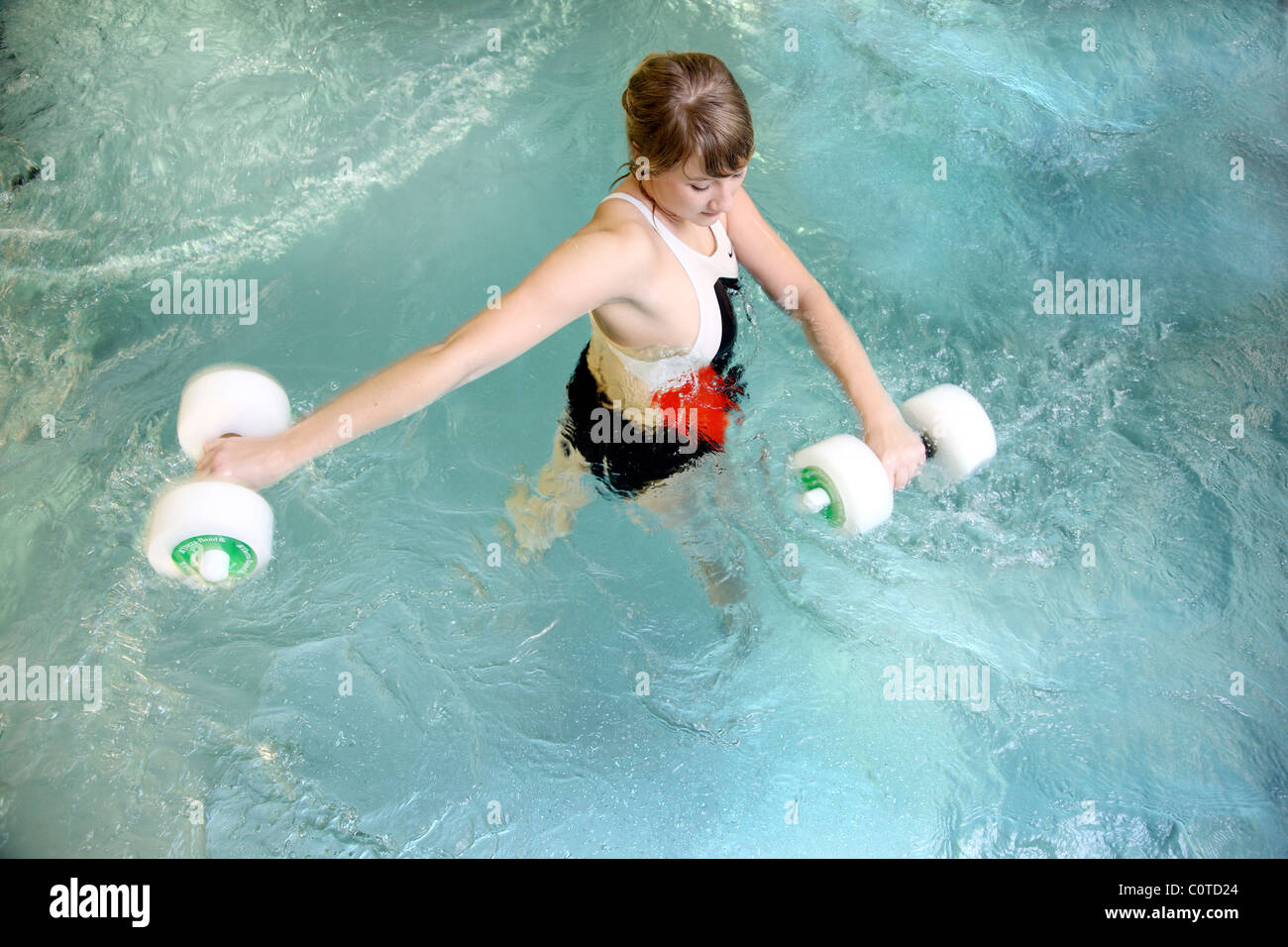 Water gymnastics, aqua aerobics as a physical therapy. Patients in a ...