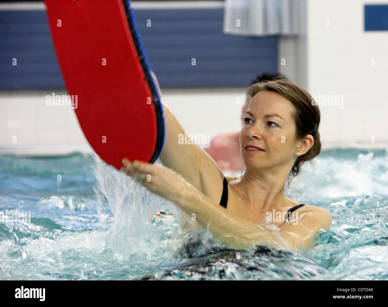Water gymnastics, aqua aerobics as a physical therapy. Patients in a ...