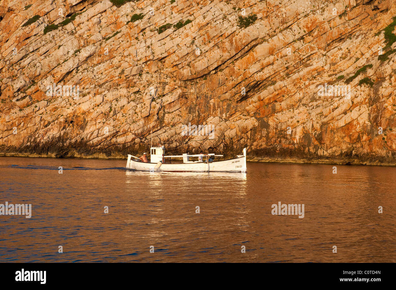 Fishing boat at sunrise in Cabrera island, National marine reserve, sea ...