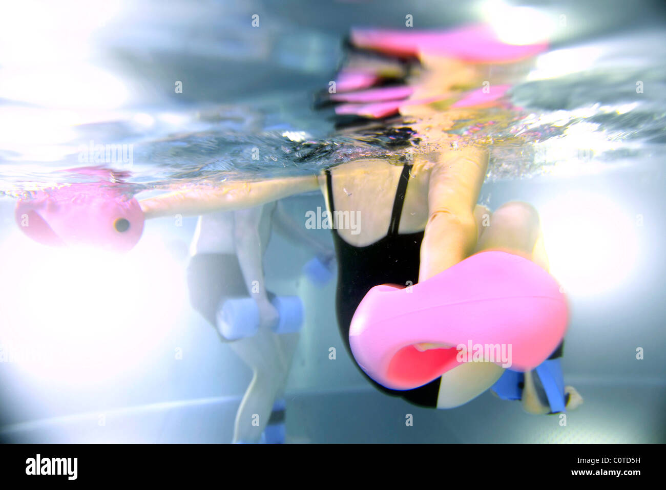 Water gymnastics, aqua aerobics as a physical therapy. Patients in a ...