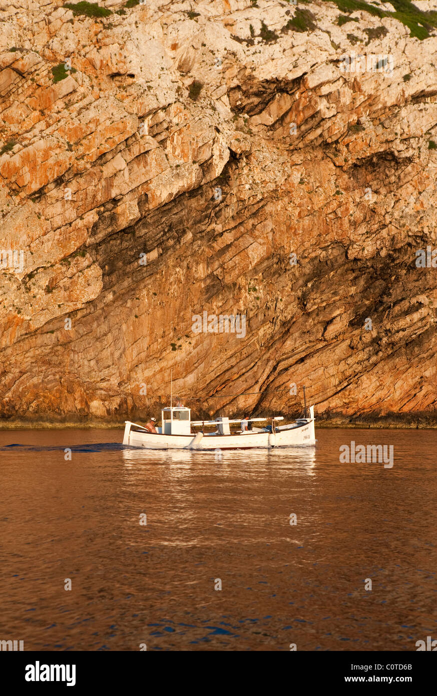 Fishing boat at sunrise in Cabrera island, National marine reserve, sea ...