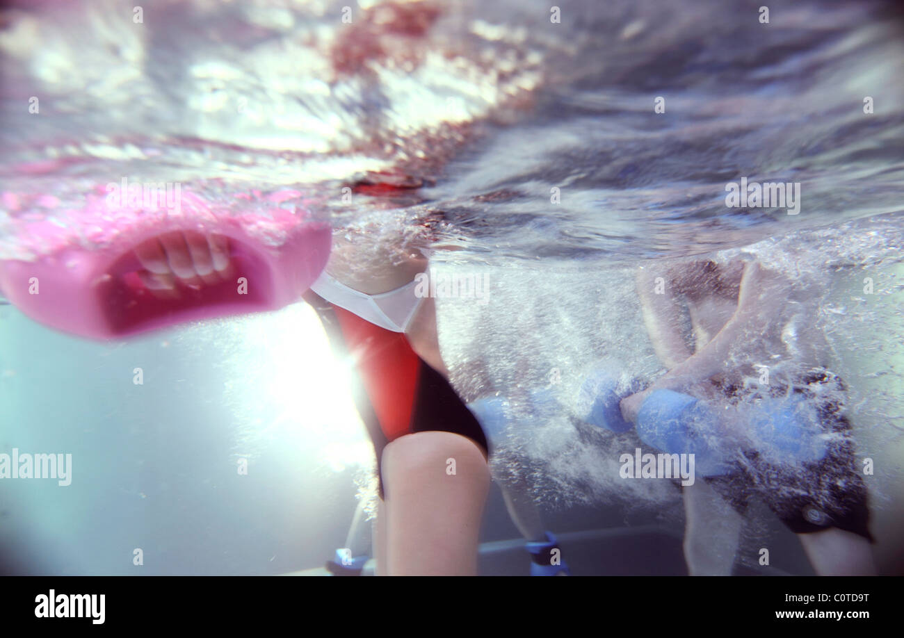 Water gymnastics, aqua aerobics as a physical therapy. Patients in a ...