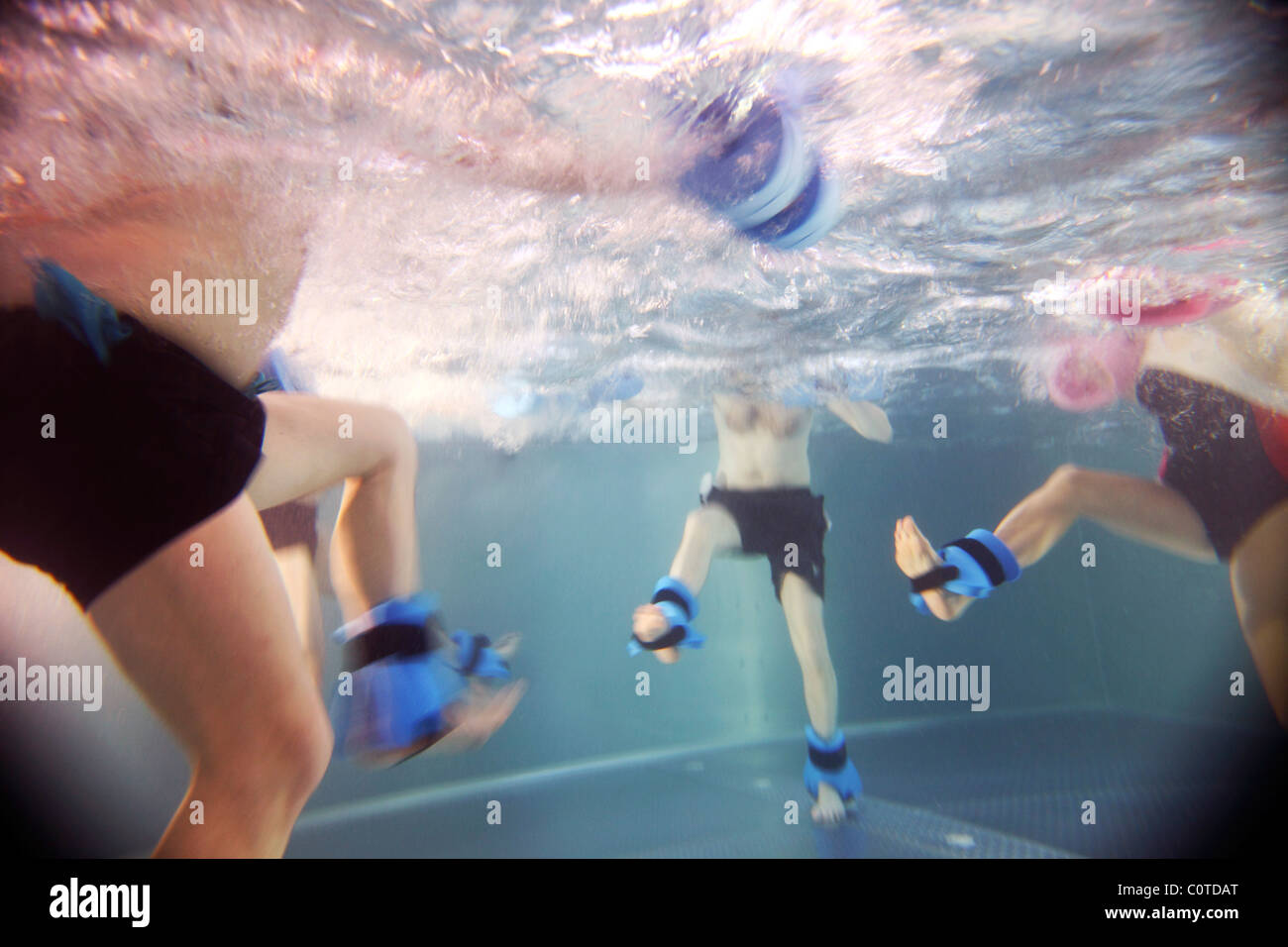 Water gymnastics, aqua aerobics as a physical therapy. Patients in a ...