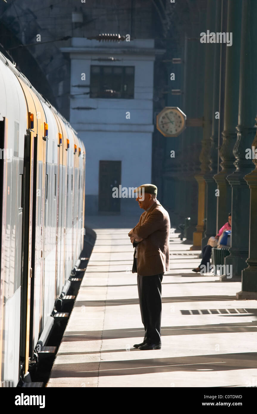 Man standing train station hi-res stock photography and images - Alamy