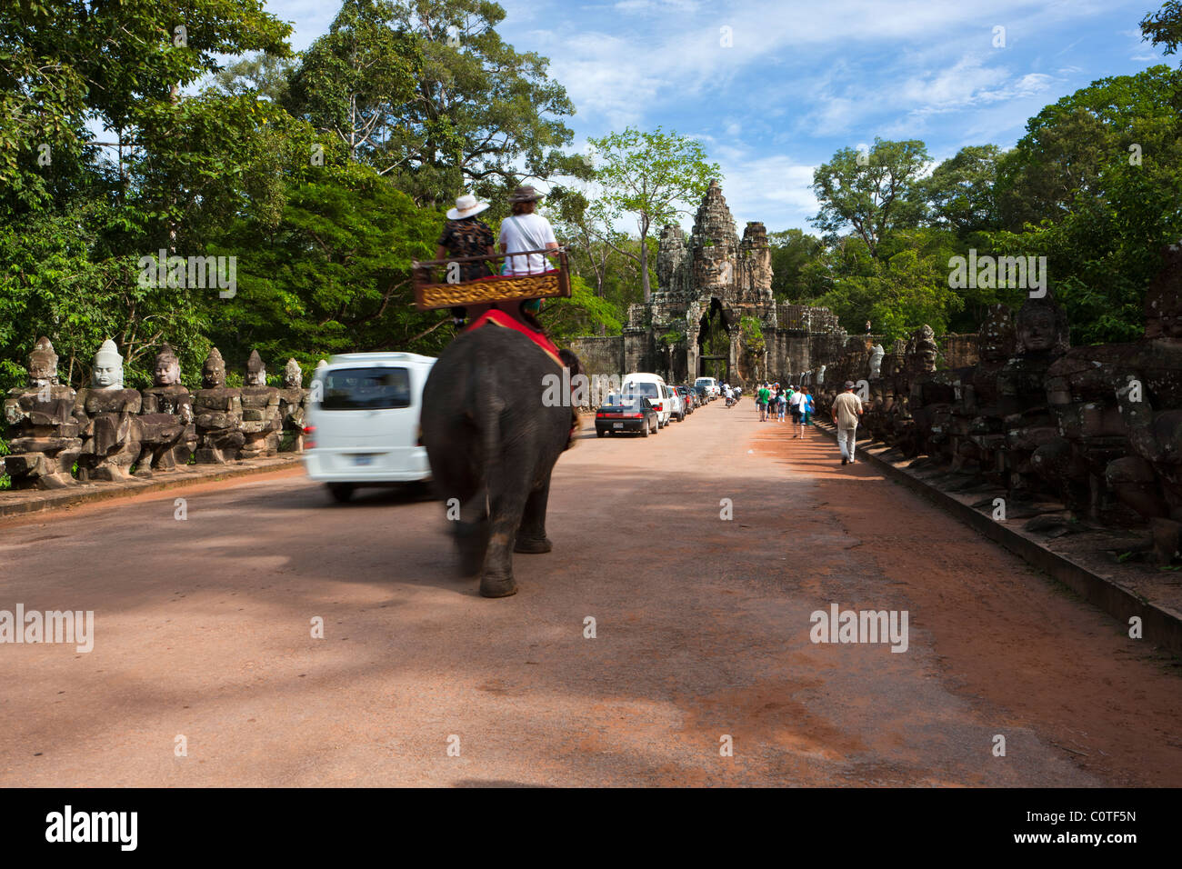 South Gate. Stone sculptures border the bridge to the temple Angkor ...