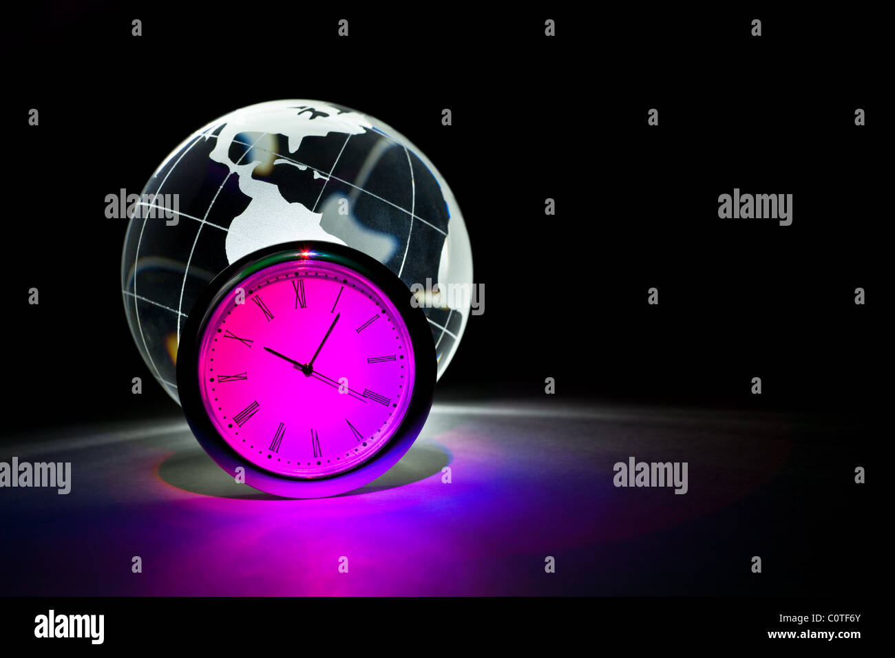 Globe and clock for background Stock Photo - Alamy