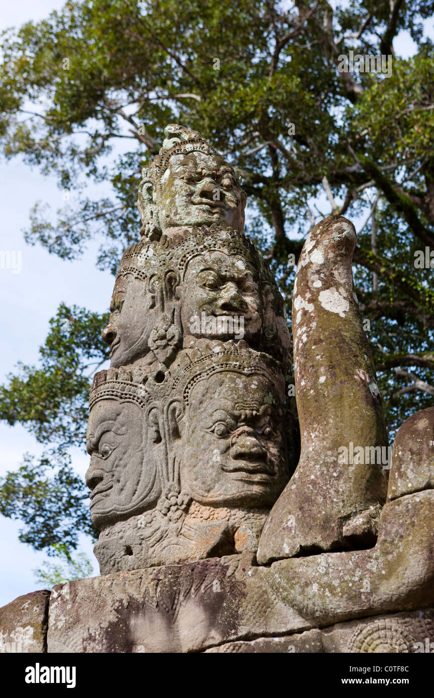 South Gate. Stone sculptures border the bridge to the temple Angkor ...