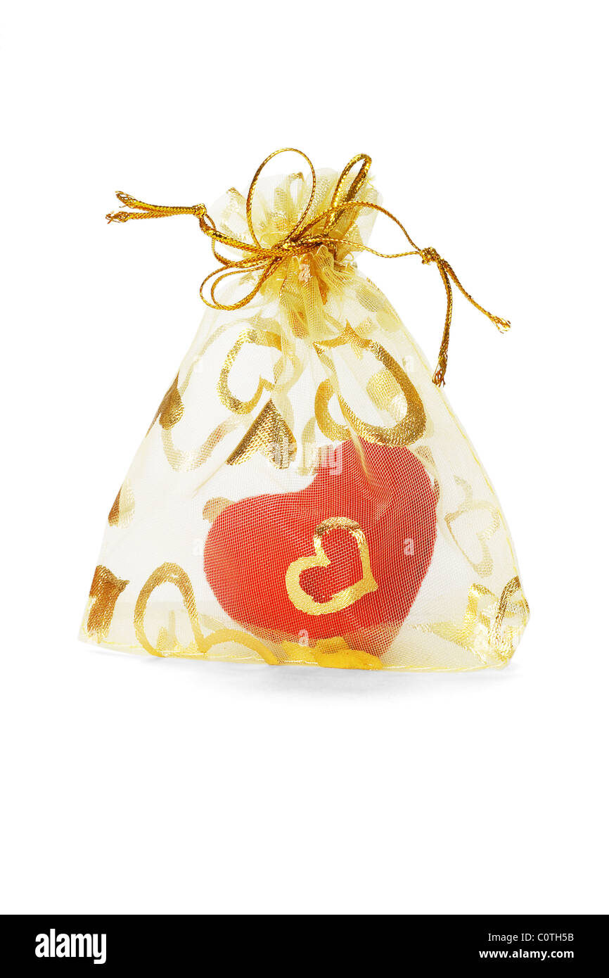 Red love heart ornament in gold sachet on white background Stock Photo ...
