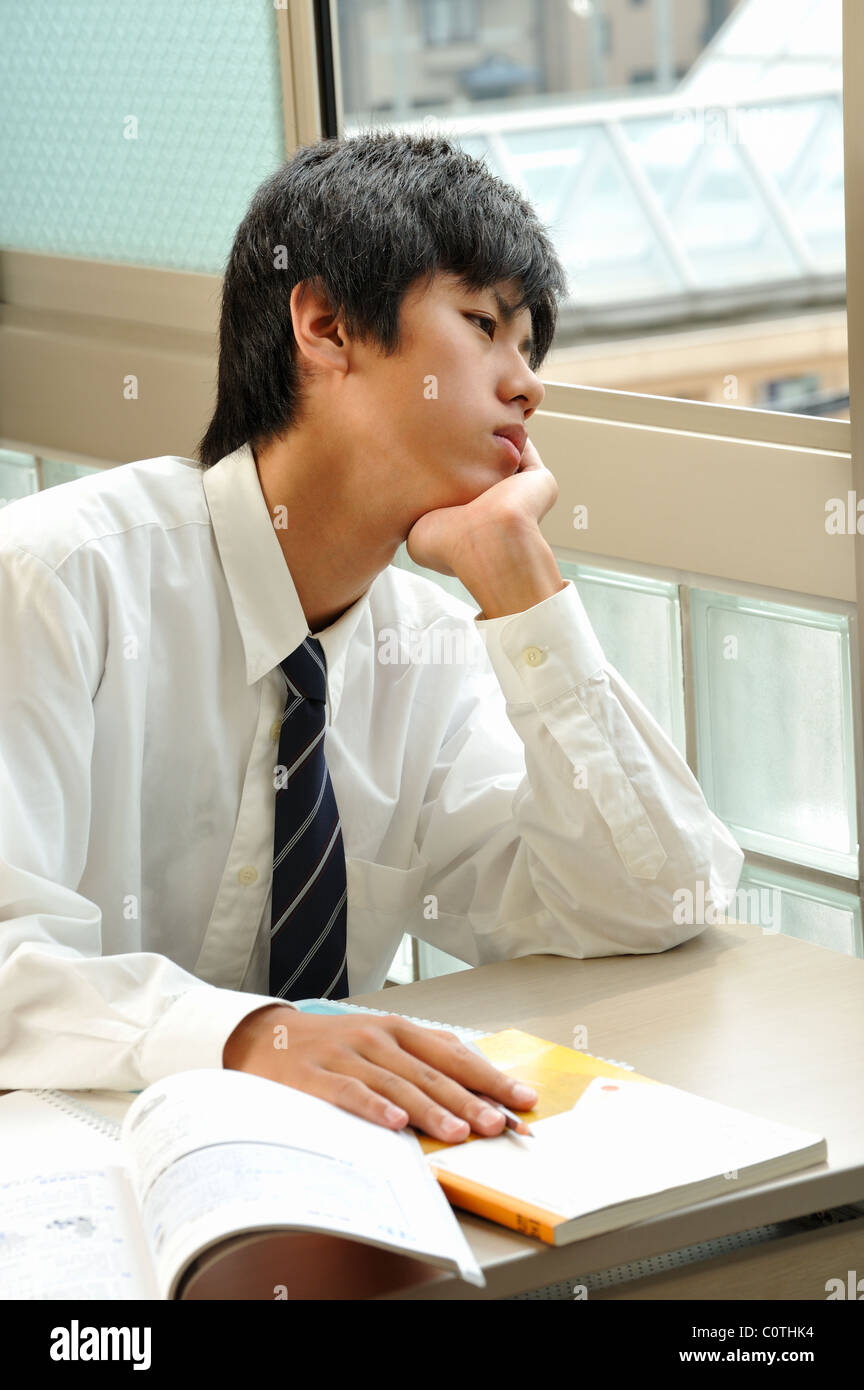 High School Boy Looking Away from Window Stock Photo - Alamy