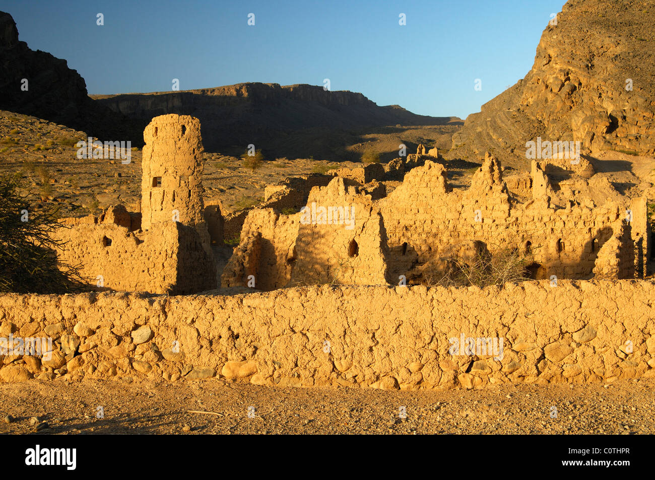Disintegrating mud-brick buildings of the abandoned town of Tanuf in ...