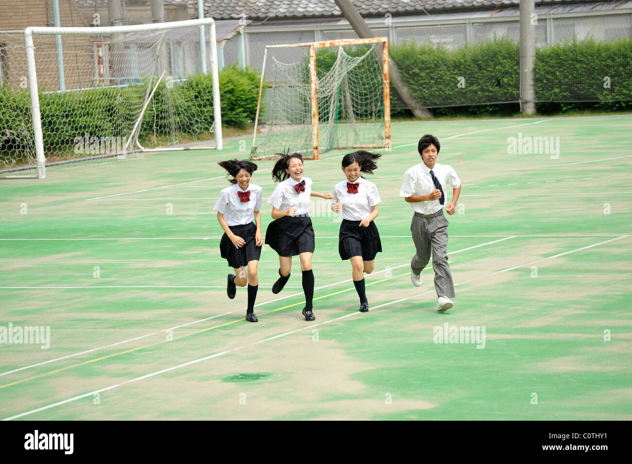 High School Students Running on the Schoolyard Stock Photo - Alamy