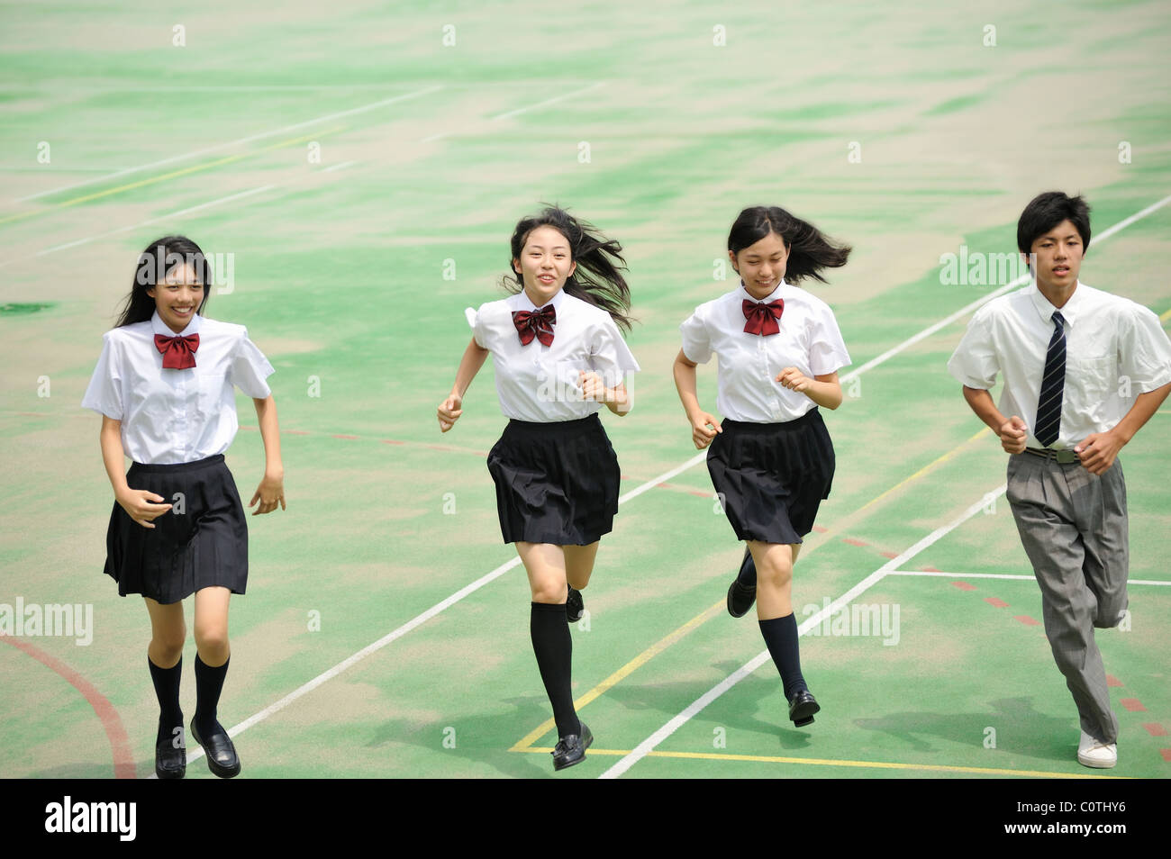 High School Students Running in the Schoolyard Stock Photo - Alamy