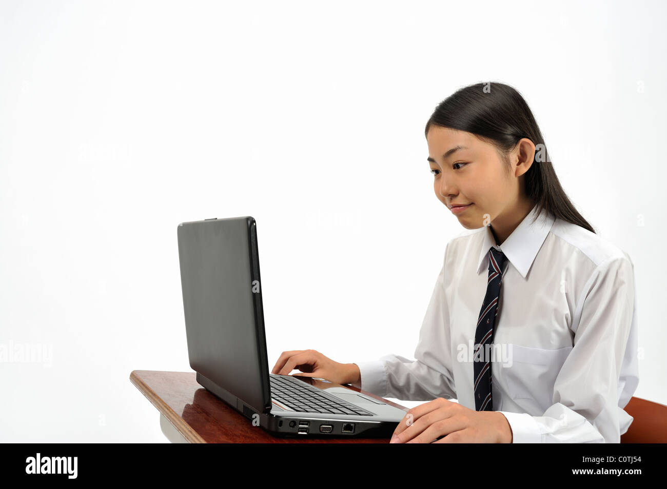 High School Girl Looking at Personal Computer Stock Photo - Alamy