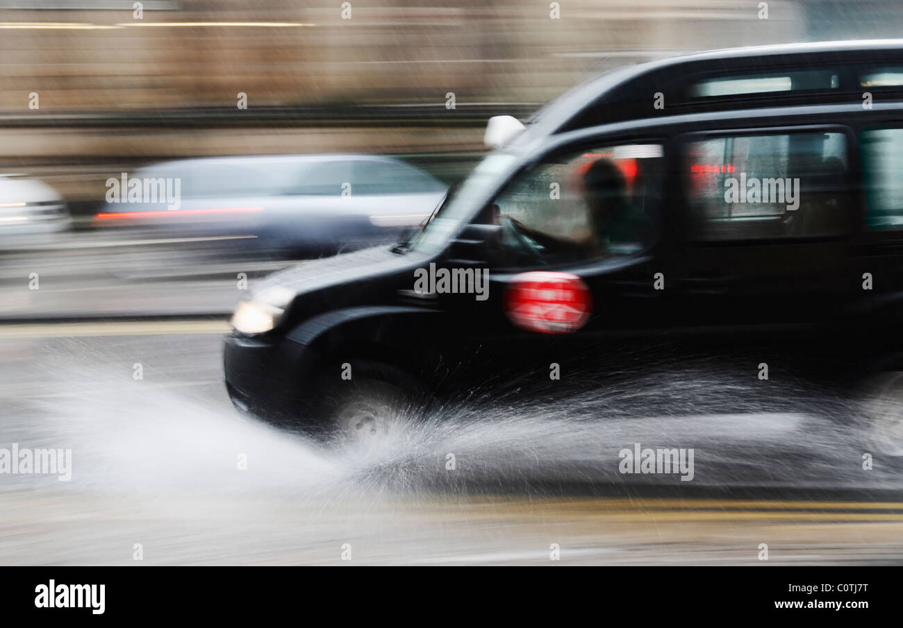 Car driving puddle hi-res stock photography and images - Alamy