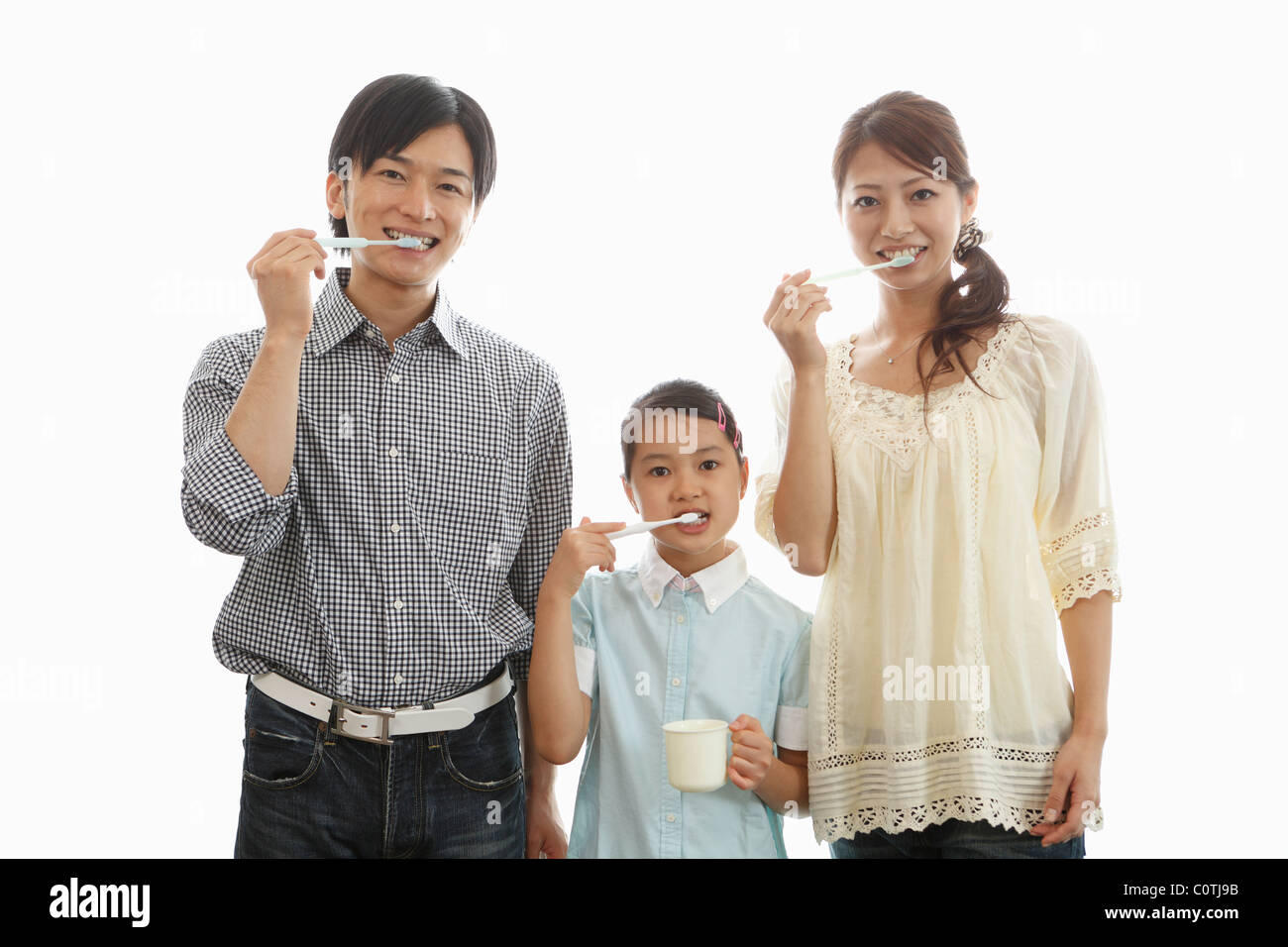 Family Brushing Teeth Together Stock Photo - Alamy
