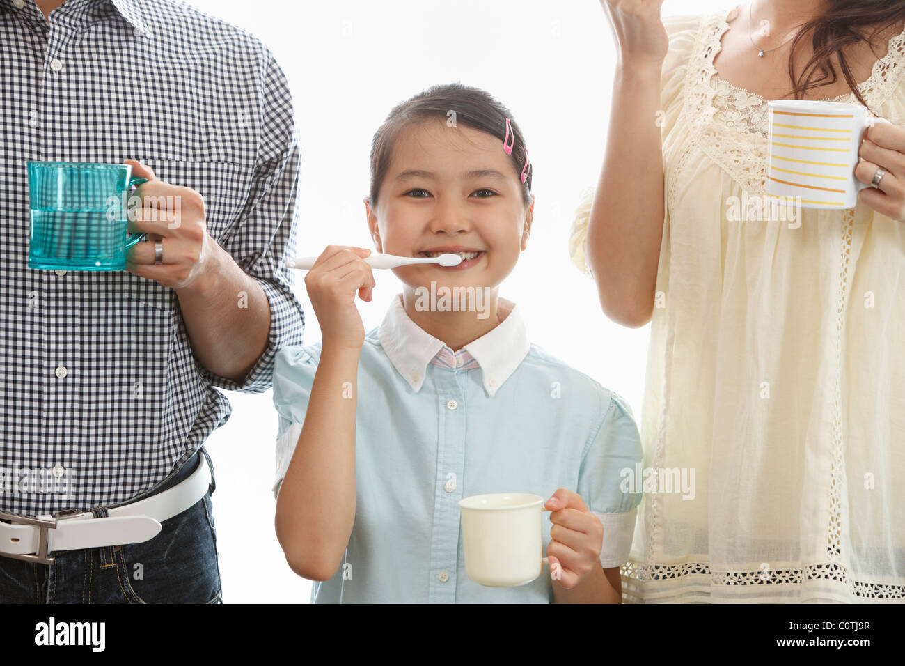 Family Brushing Teeth Together Stock Photo - Alamy