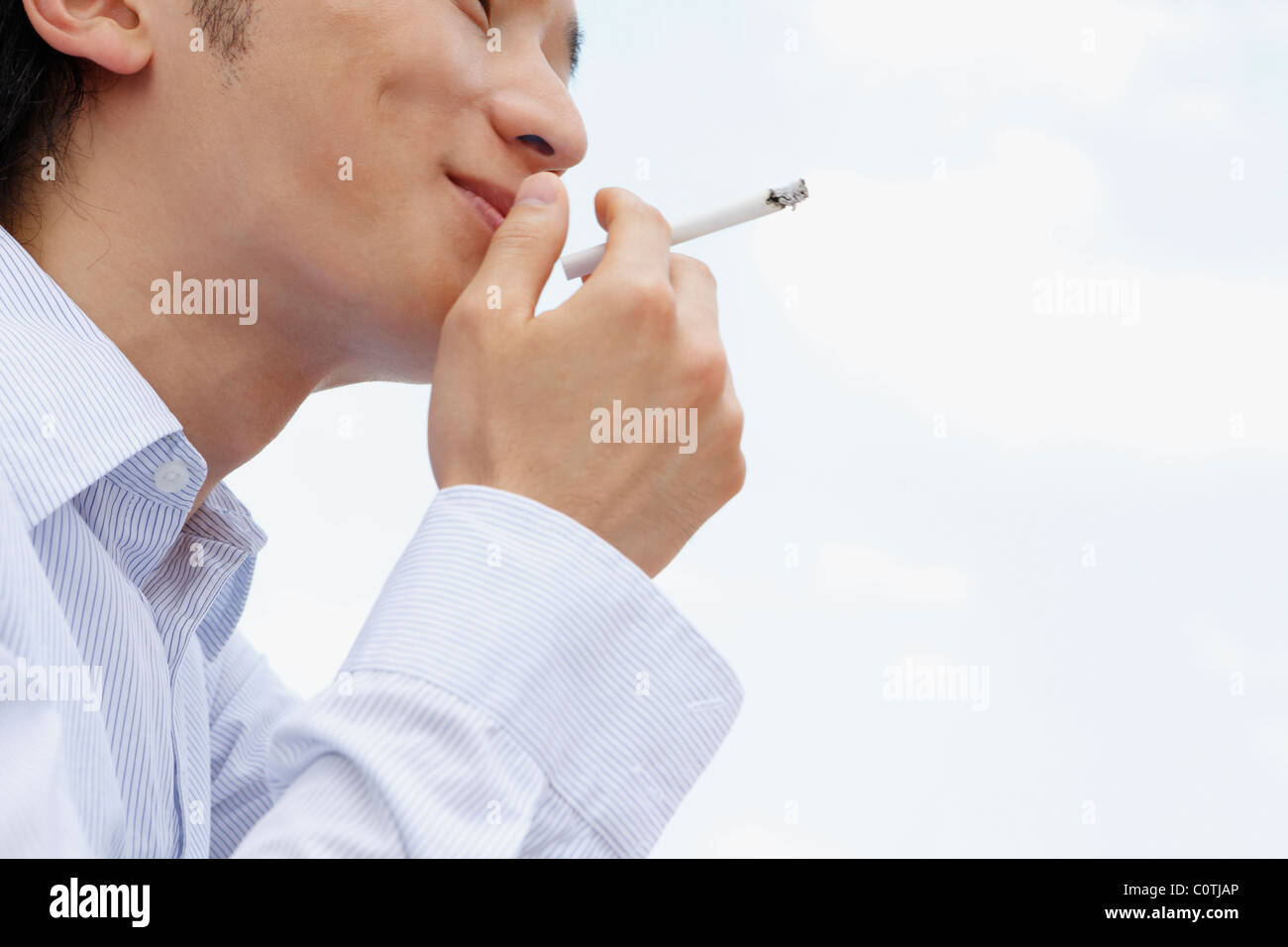 Mid Adult Man Smoking Stock Photo - Alamy