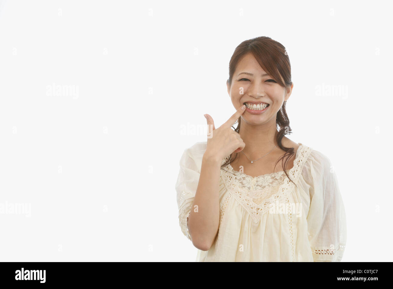 Young Woman Showing Teeth Stock Photo - Alamy