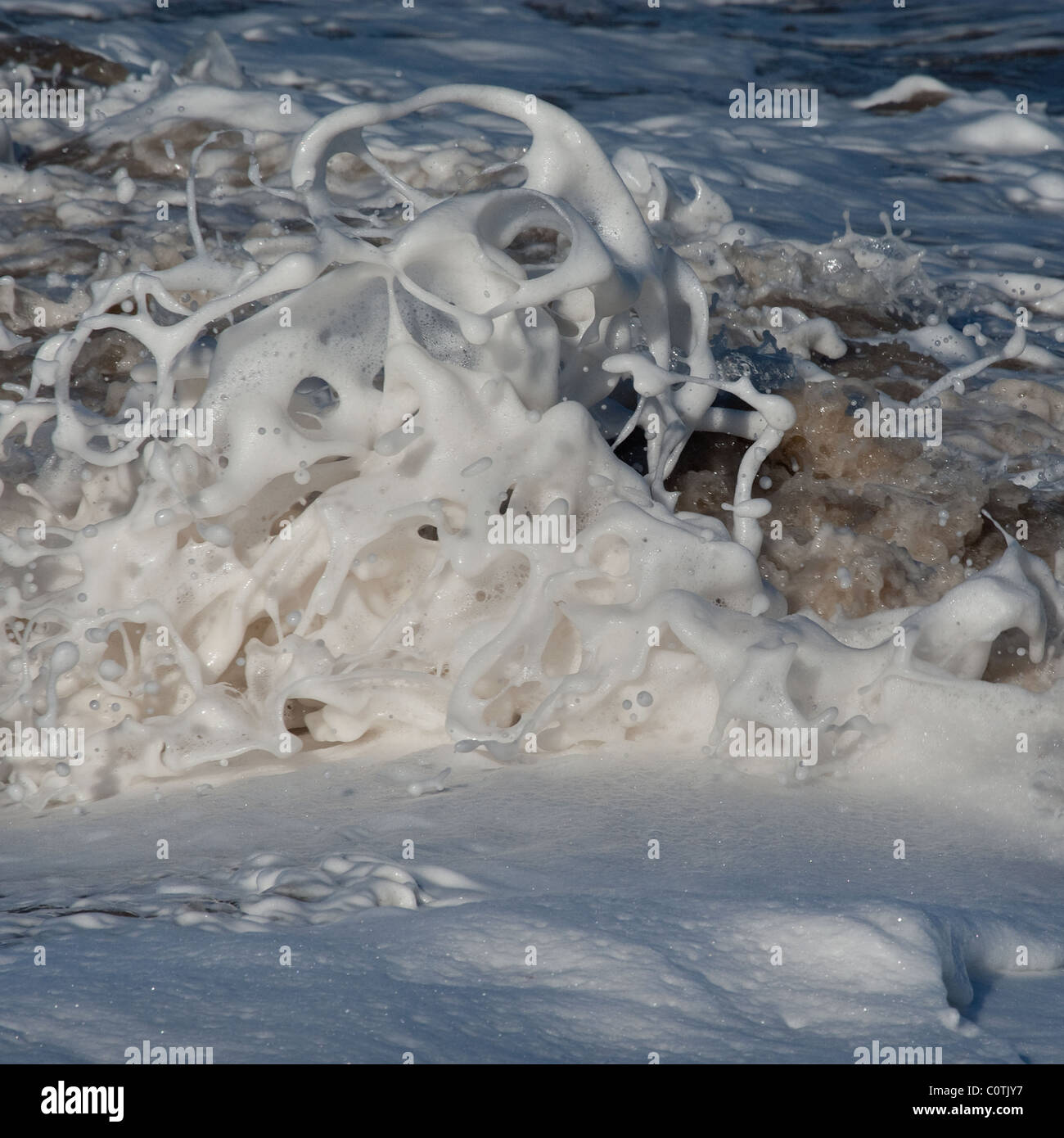 Waves on the shoreline Stock Photo - Alamy