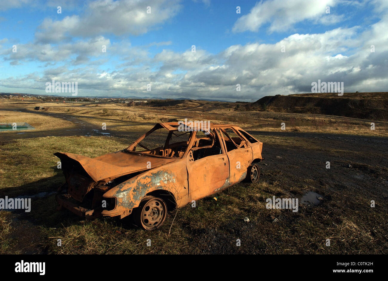 burned out car in field Stock Photo - Alamy