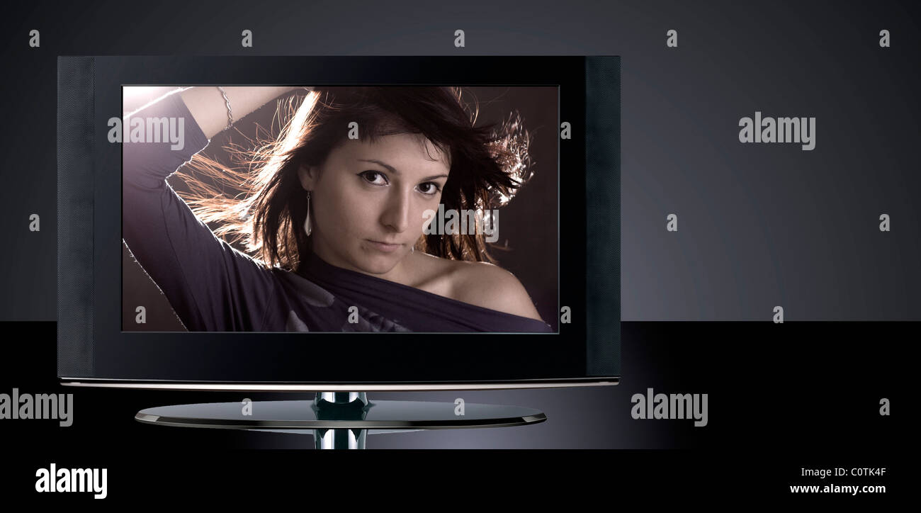 LCD TV shot on reflective table on blue background Stock Photo - Alamy