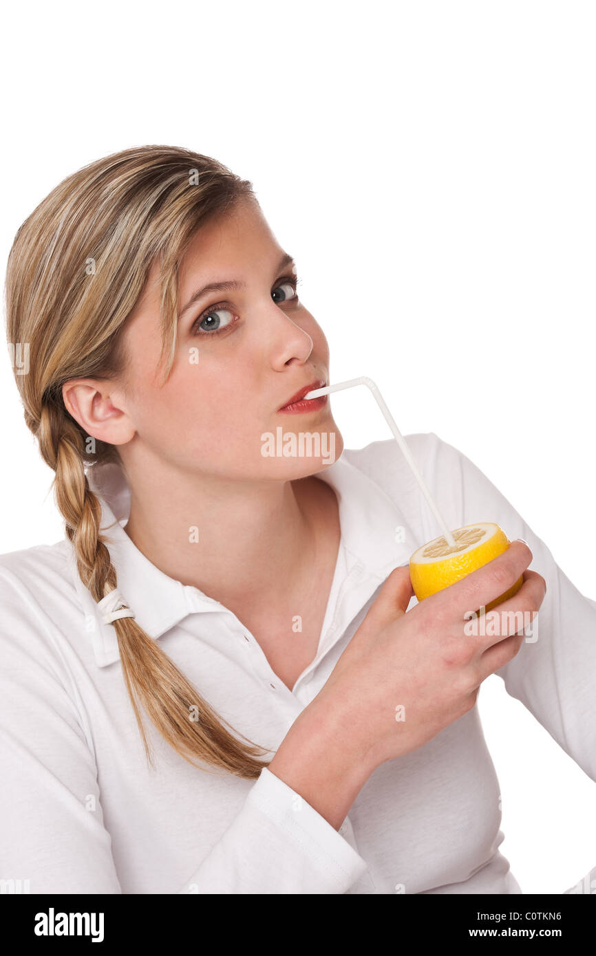 Woman holding lemon with straw on white background Stock Photo - Alamy