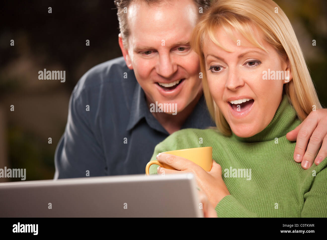 Young excited couple using hi-res stock photography and images - Alamy