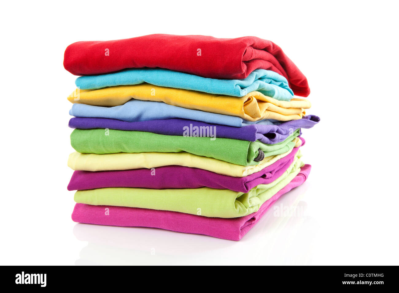 Pile of colorful clothes over white background Stock Photo - Alamy