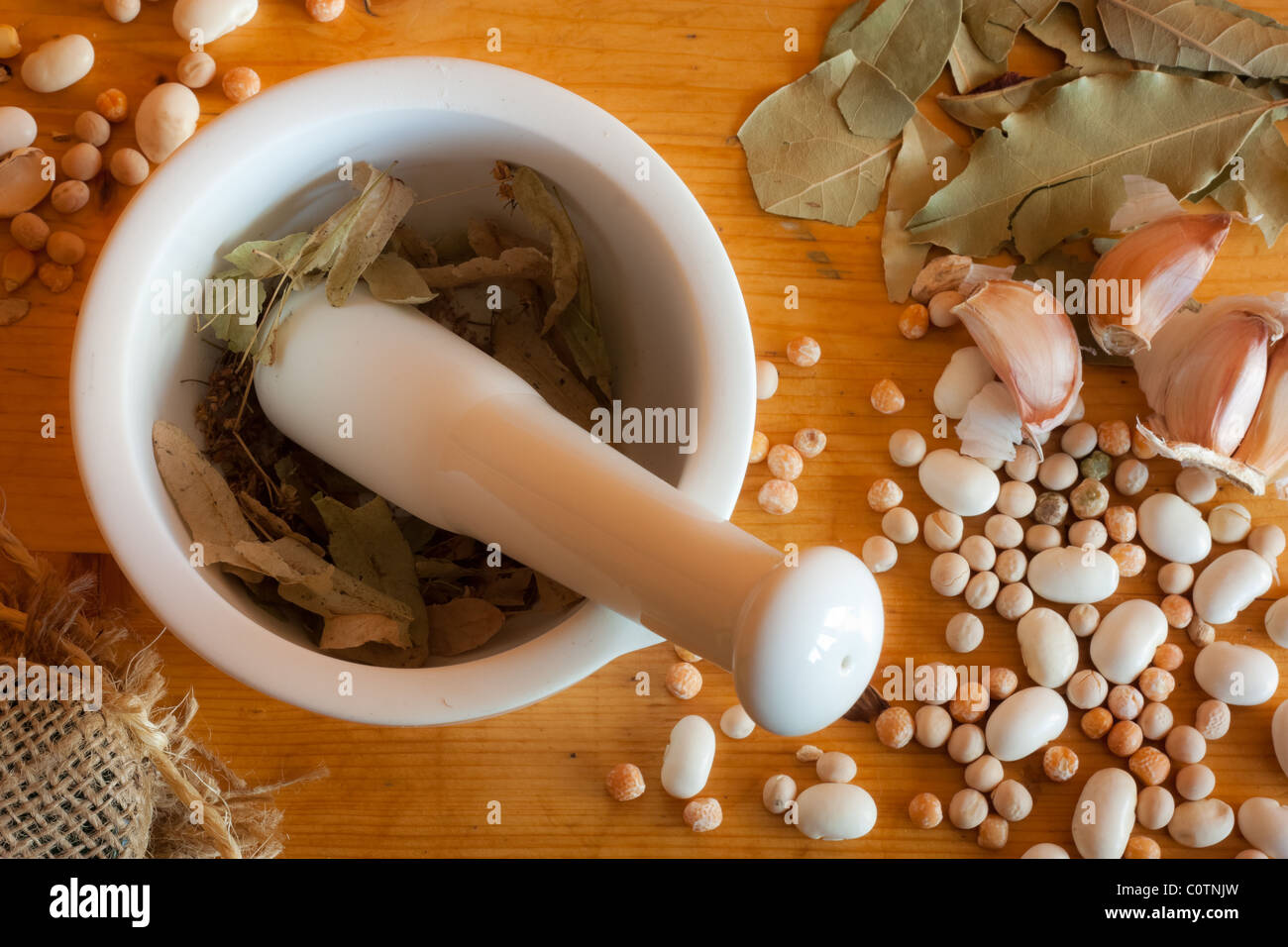 Mortar with herbs Stock Photo - Alamy