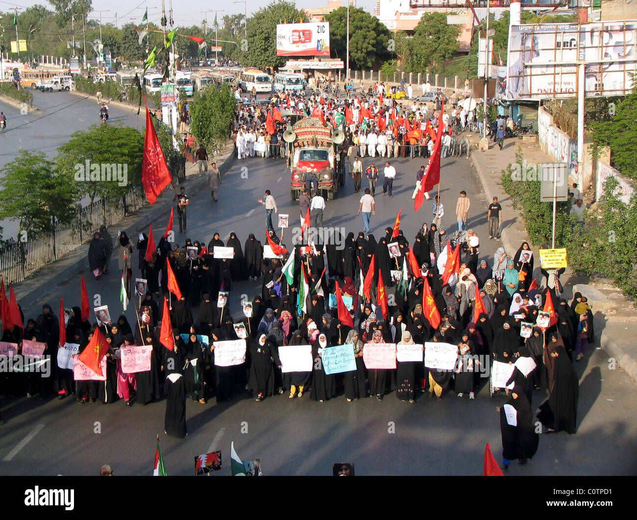 Supporters of Majlis Wahdat-e-Muslimeen (MWM) pass through MA.Jinnah ...