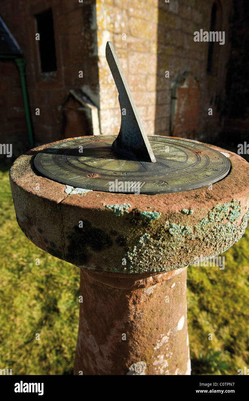 Stone Sun dial in the churchyard at Culgaith Cumbria Stock Photo - Alamy