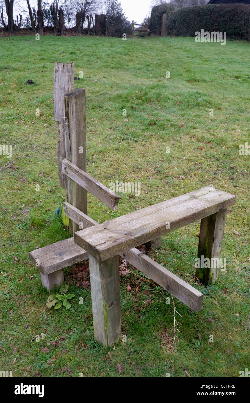 A single broken countryside stile inexplicably located in the centre of ...