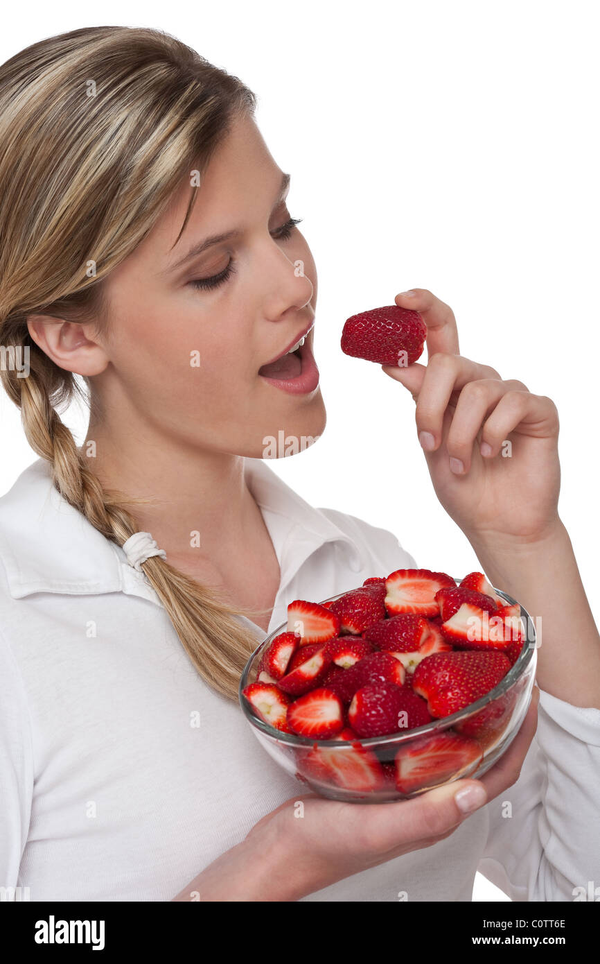 Healthy lifestyle series - Woman eating strawberry on white background ...