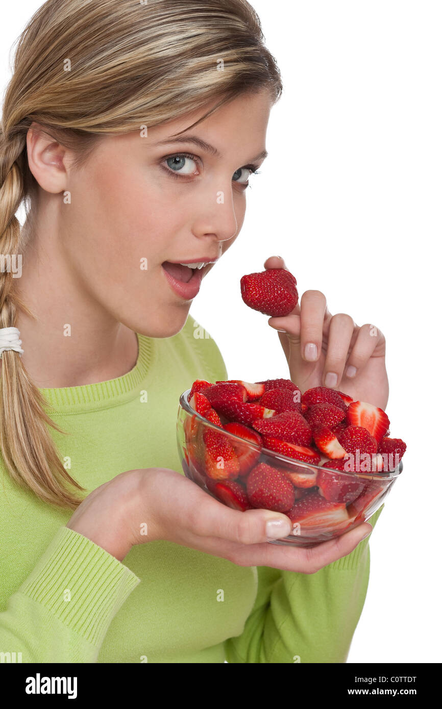Healthy lifestyle series - Woman eating strawberry on white background ...