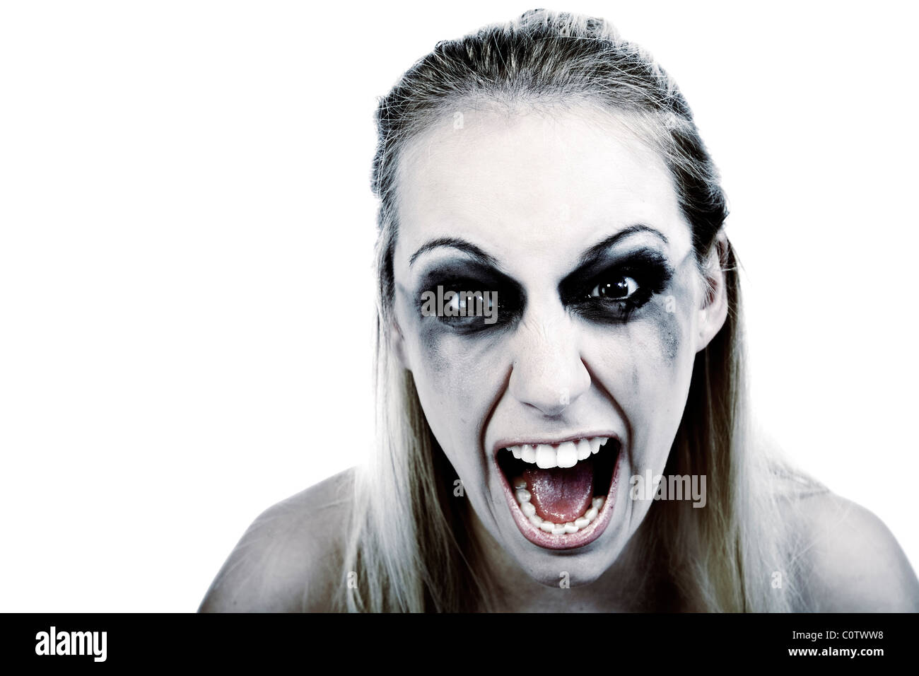 Studio portrait of a young blond woman in horror Stock Photo - Alamy