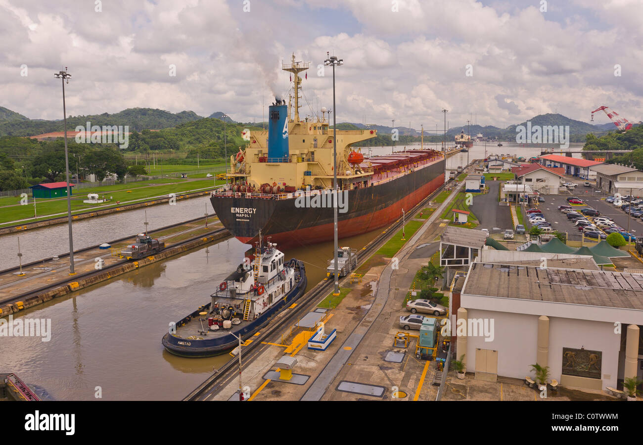 PANAMA - Ship at Miraflores Locks and tugboat on the Panama Canal Stock ...