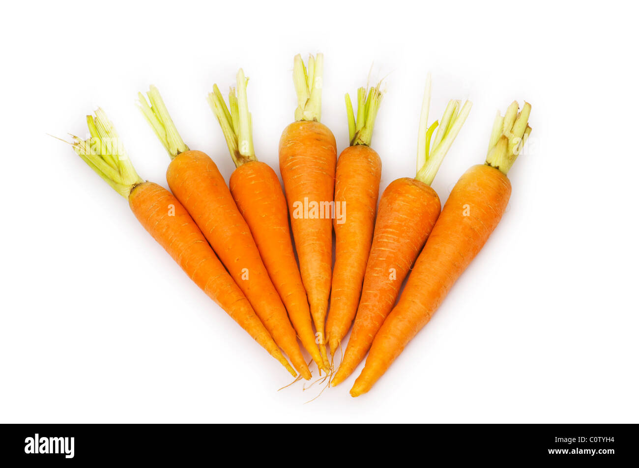 Many carrots isolated on the white background Stock Photo - Alamy