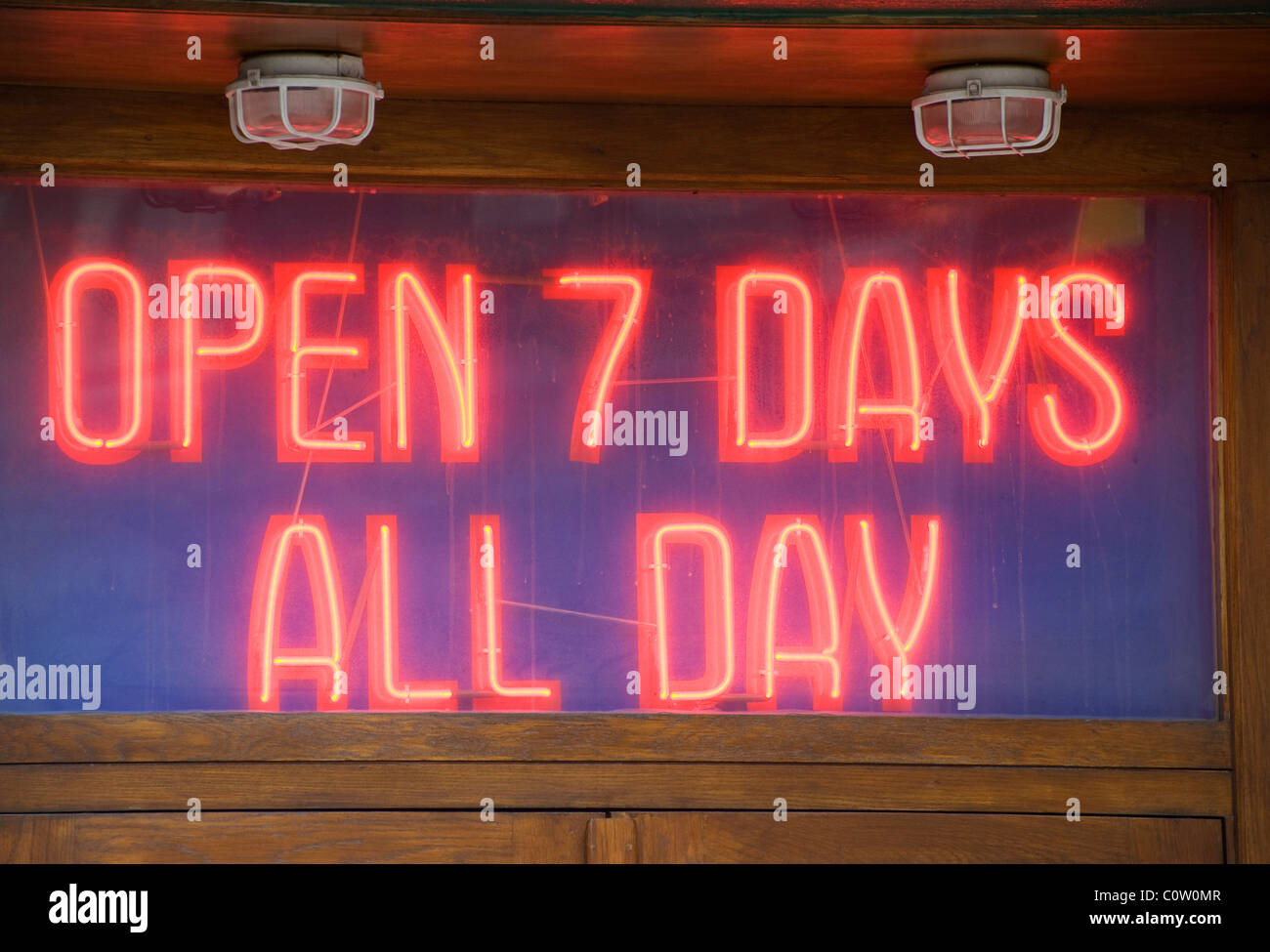 neon illuminated shop sign United Kingdom Stock Photo - Alamy