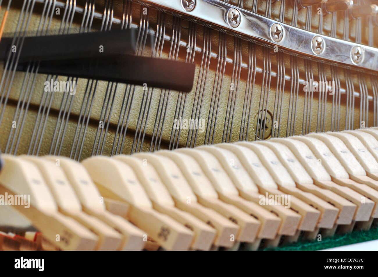 Adjusting the piano string tension for a good sound Stock Photo - Alamy
