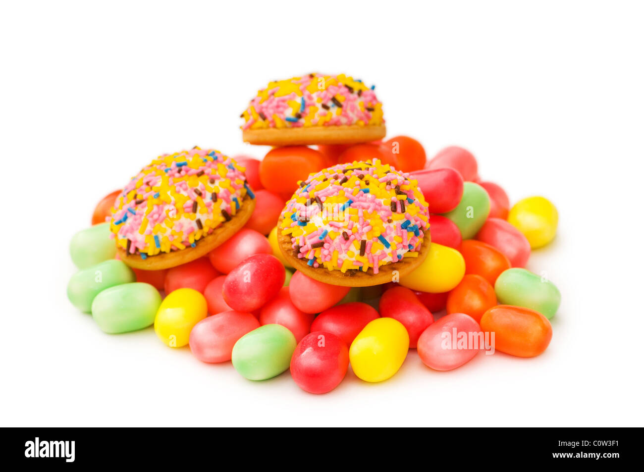 Sweet cakes and colourful gums at the background Stock Photo - Alamy