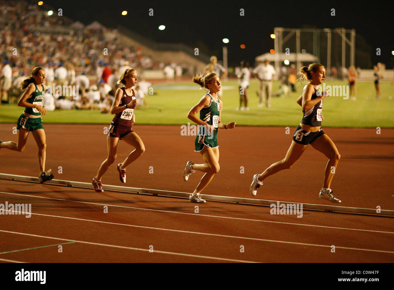Anglo female runners jockey for position during a distance race at the ...