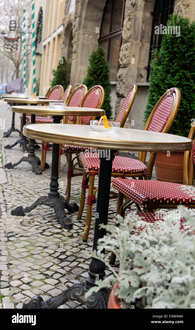 Seats and tables outside a cafe in Berlin Stock Photo - Alamy