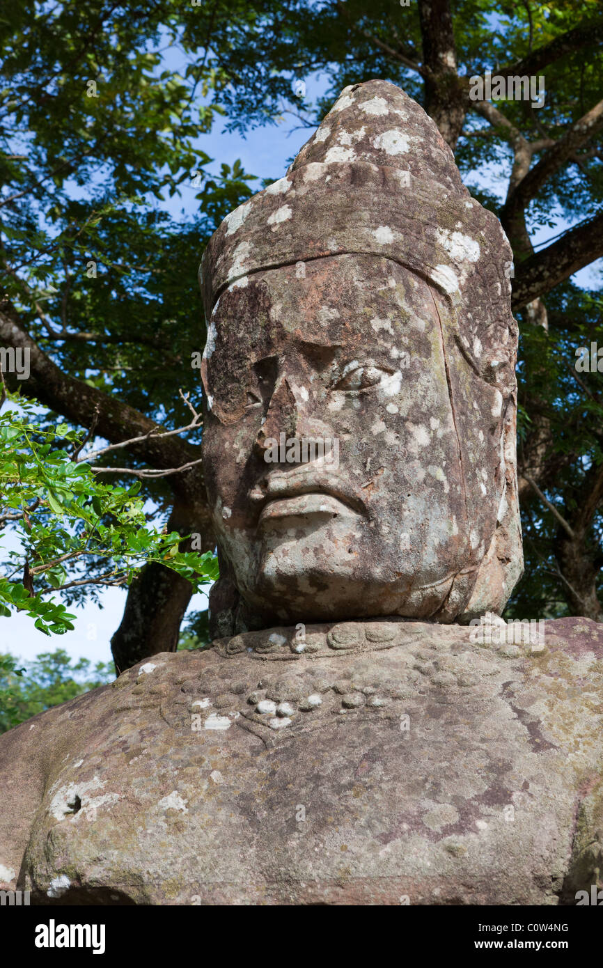 South Gate. Stone sculptures border the bridge to the temple Angkor ...
