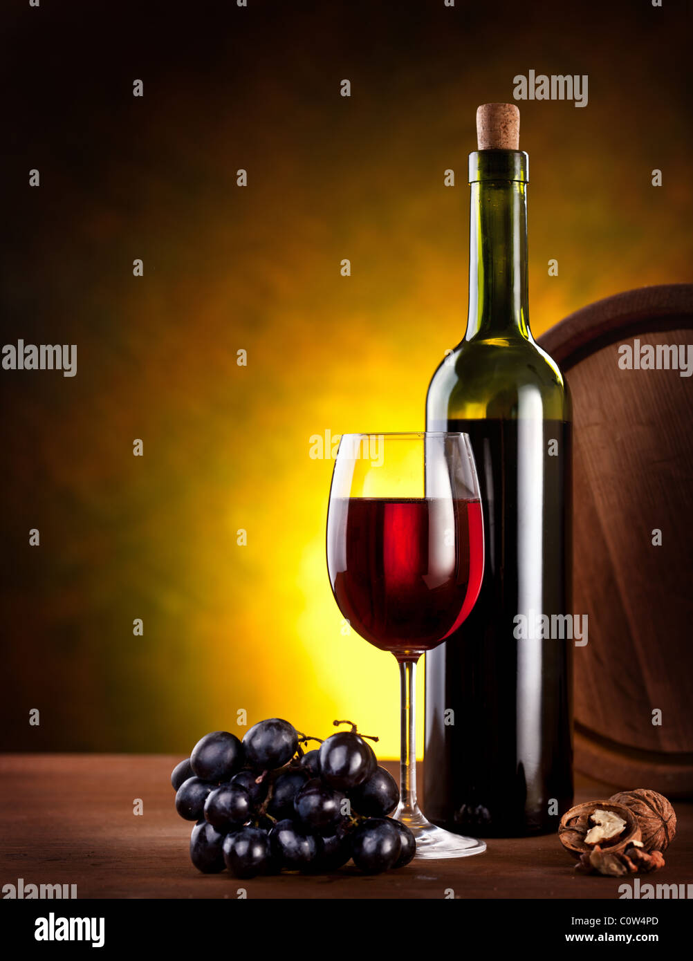 Still life with wine bottle, glass and oak barrels Stock Photo - Alamy