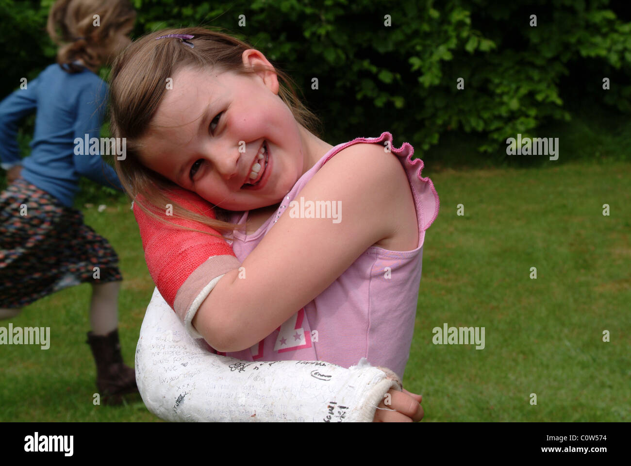 Little girl with two broken arms Stock Photo - Alamy