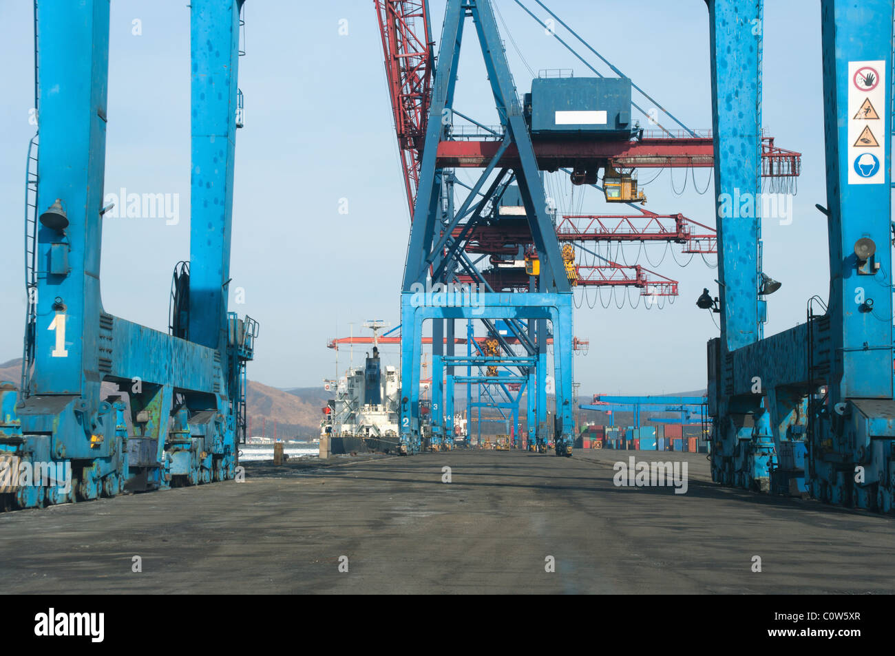 Cargo dock crane with stacks of containers Stock Photo - Alamy