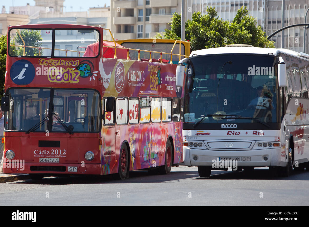 Tourist buses. Open top bus and coach. Cadiz Stock Photo - Alamy