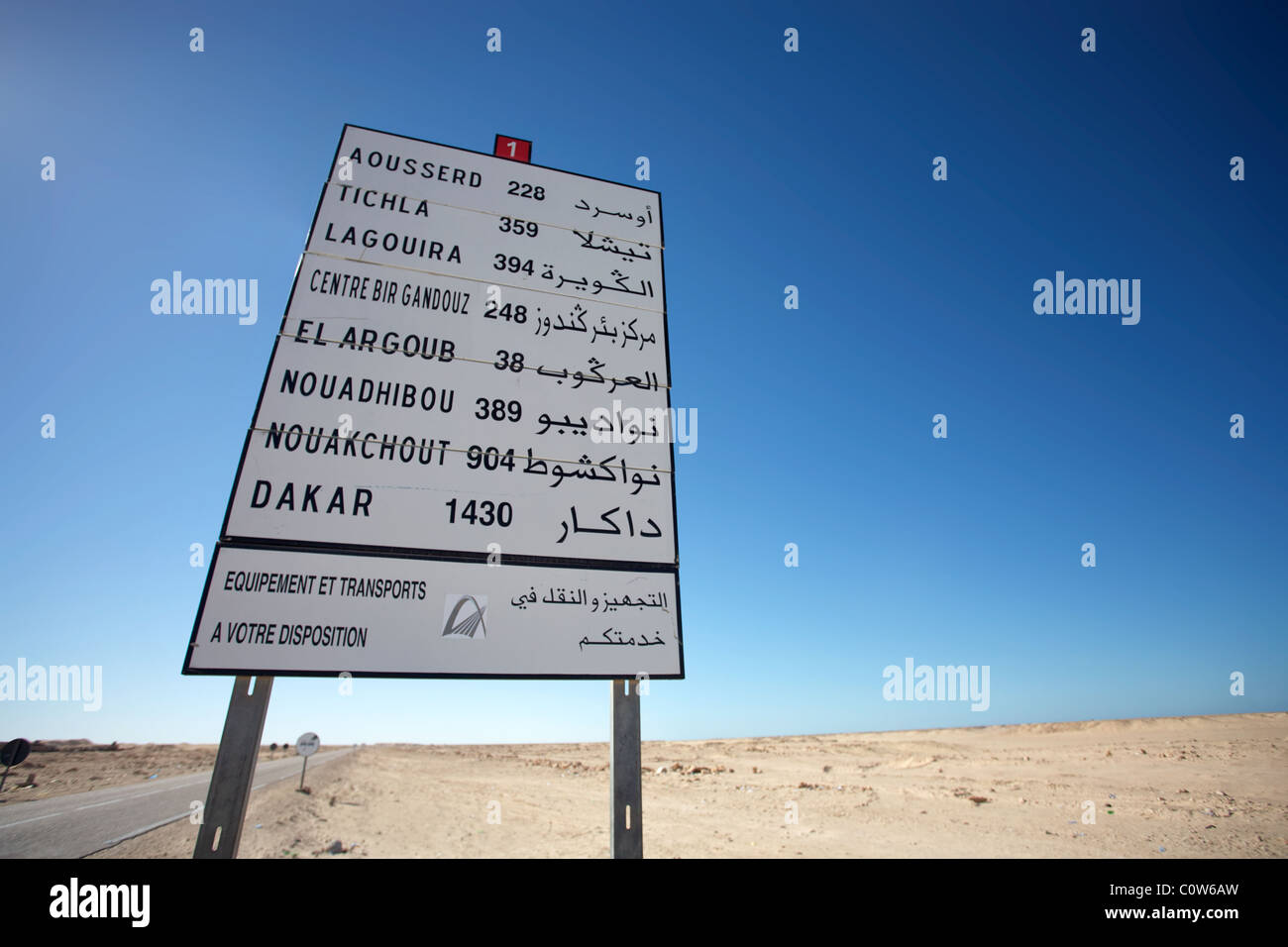 White road Sign on the road to Mauritania with blue sky Stock Photo - Alamy