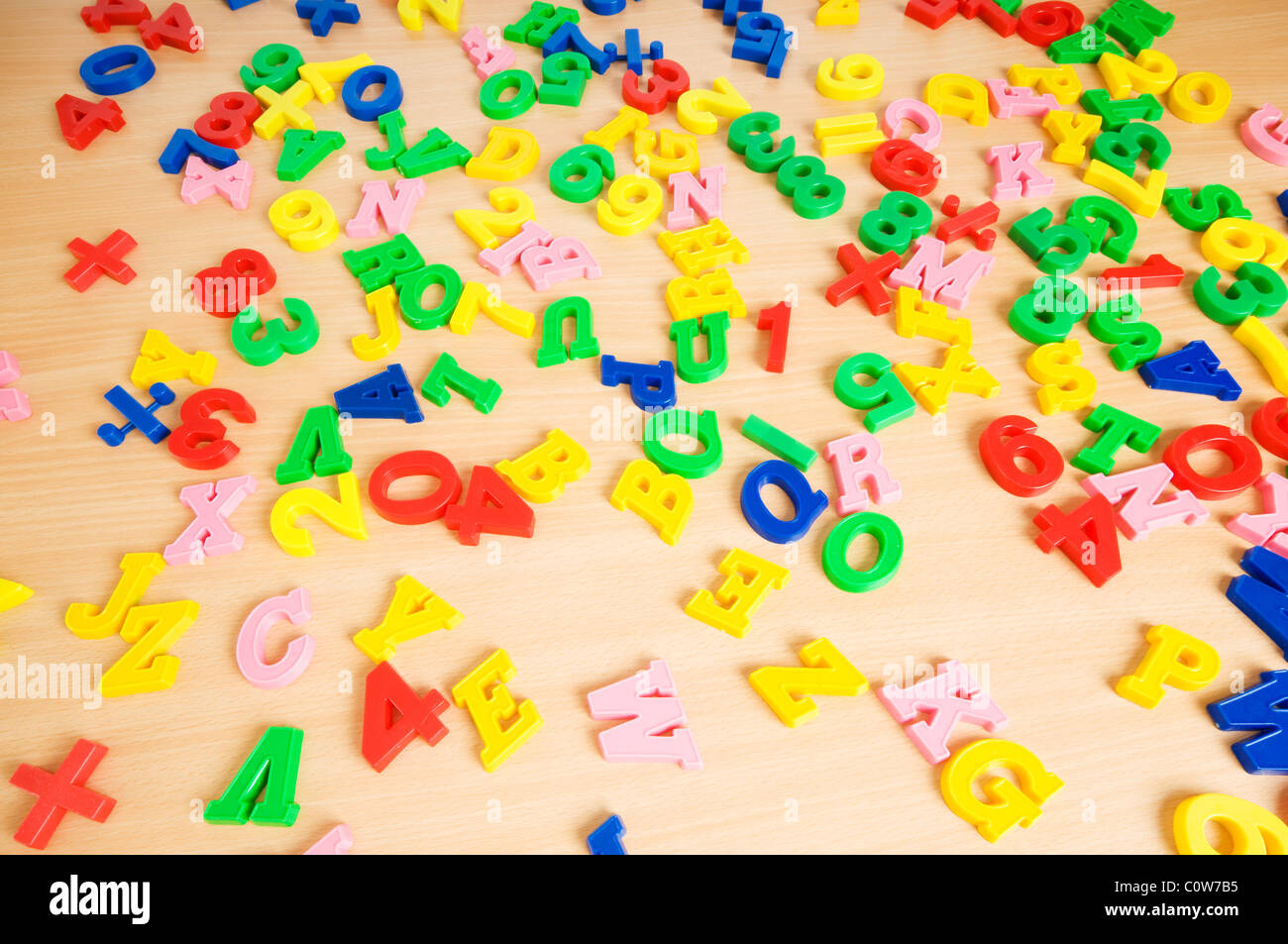 Children letters and digits on the table Stock Photo - Alamy