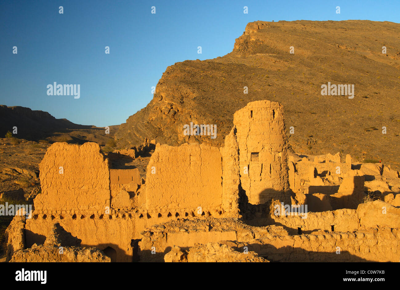 Disintegrating mud-brick buildings of the abandoned town of Tanuf in ...